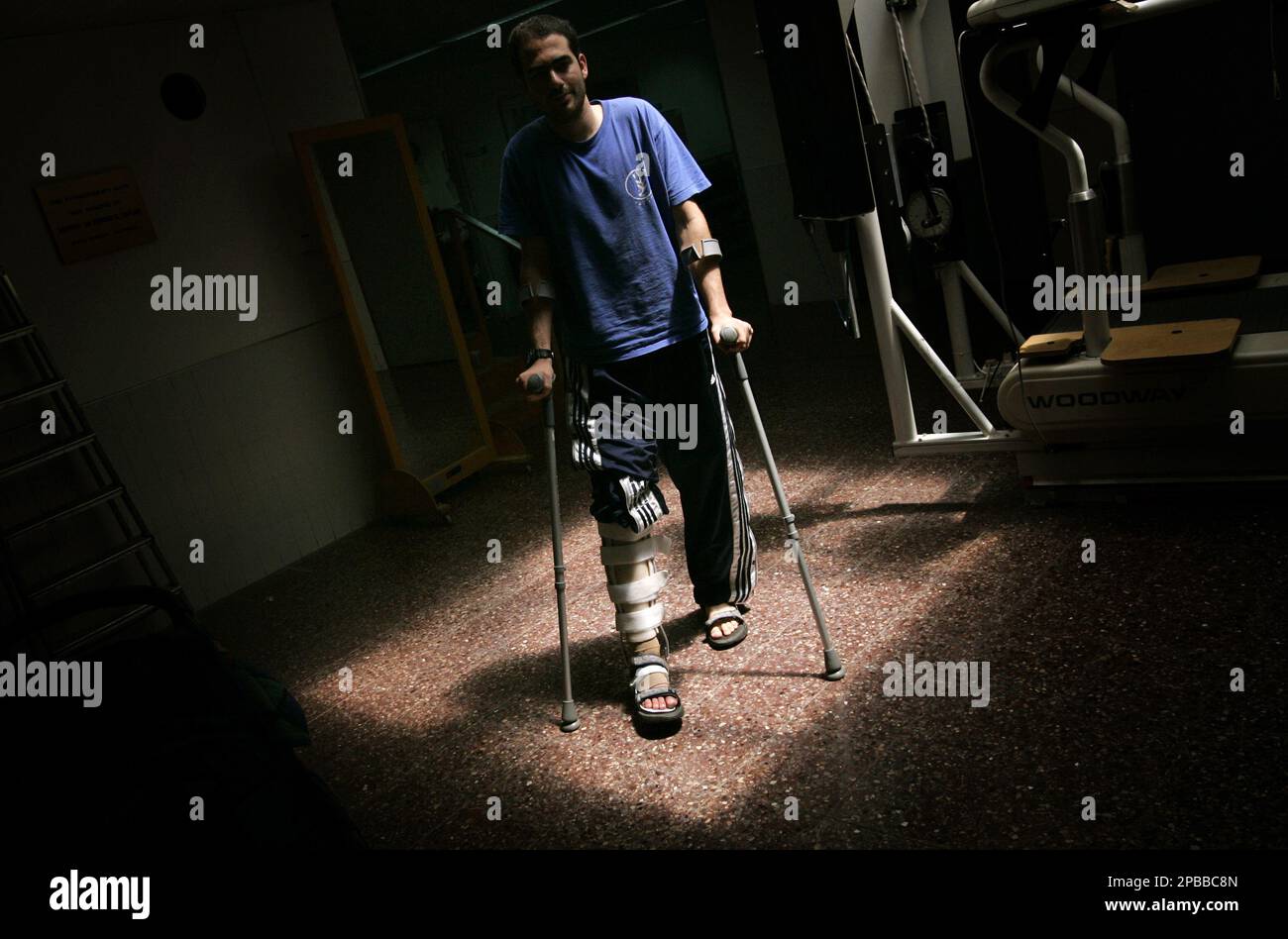 Israeli Army Lt.Asael Lubotzky, 24, walks with the help of crutches ...