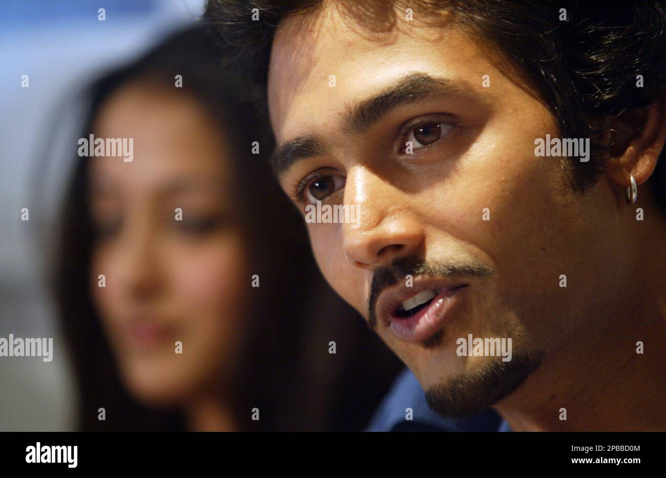 Indian Bollywood actor Shayan Munshi, right, speaks to the media as ...