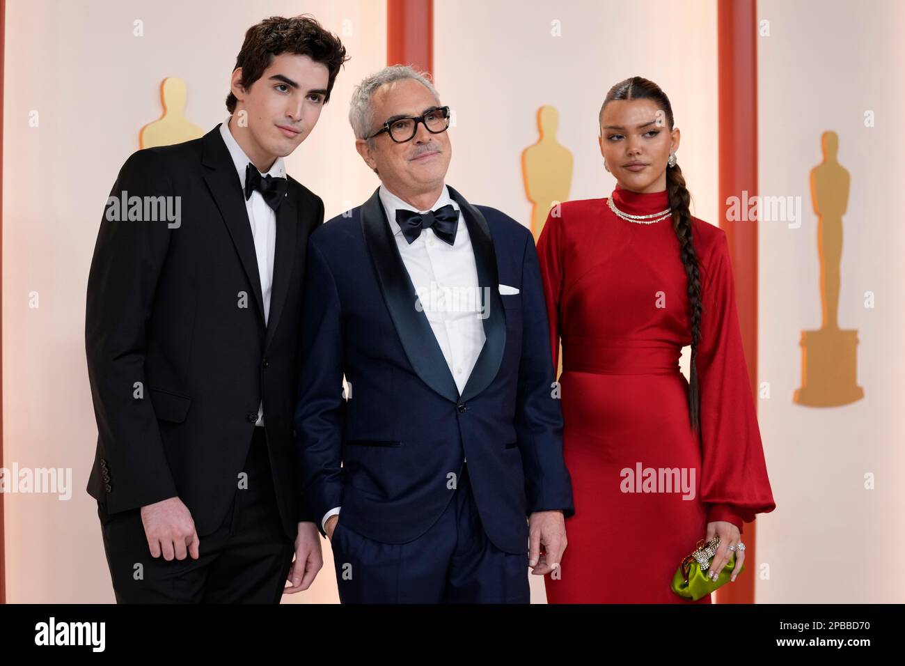 Olmo Teodoro Cuarón, from left, Alfonso Cuarón andTess Bu Cuarón arrive ...