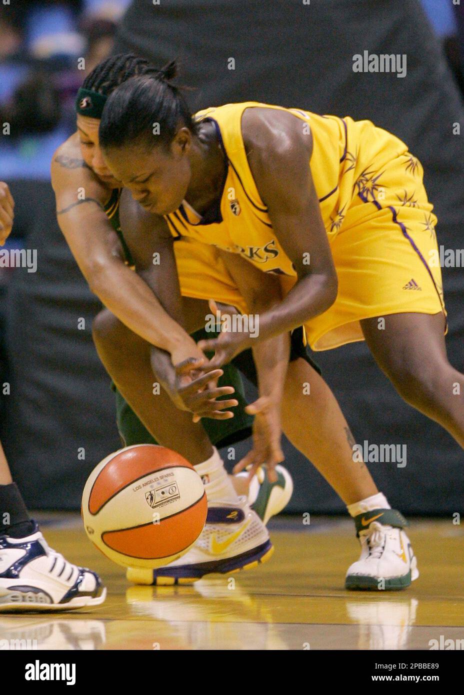 Seattle Storm's Betty Lennox, left, battles Los Angeles Sparks' Sherill ...