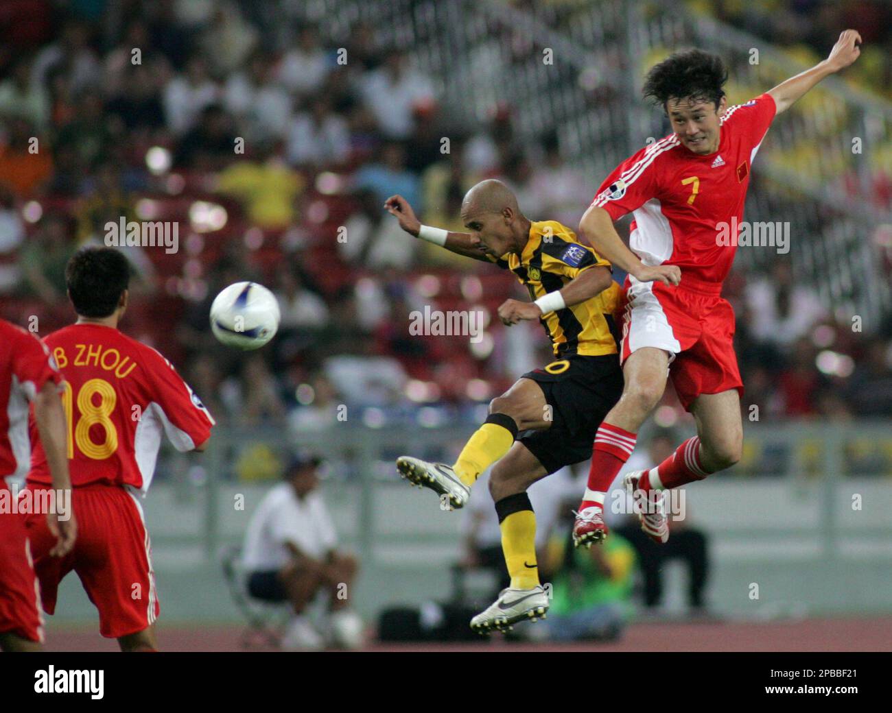 Mohamad Hardi Jaafar, left, from Malaysia goes up for a header against ...