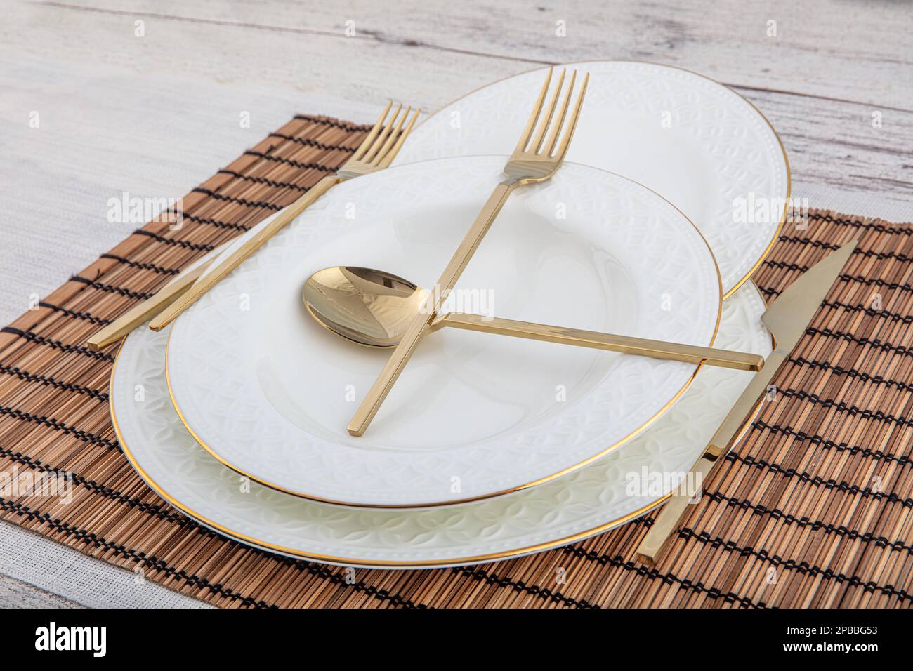 Plates and utensils, Plate, Bowl and golden cutlery on wicker american ...