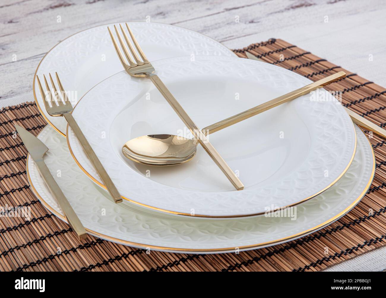 Plates and utensils, Plate, Bowl and golden cutlery on wicker american ...