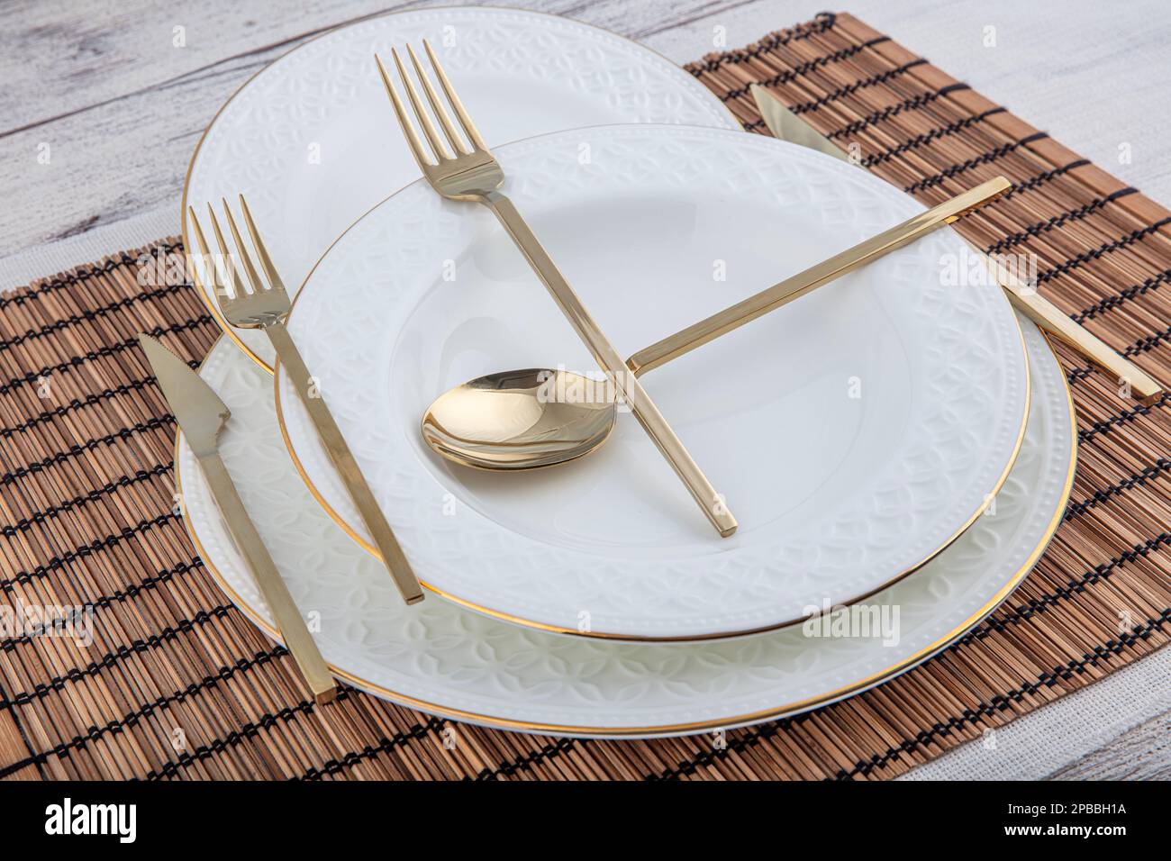 Plates and utensils, Plate, Bowl and golden cutlery on wicker american ...