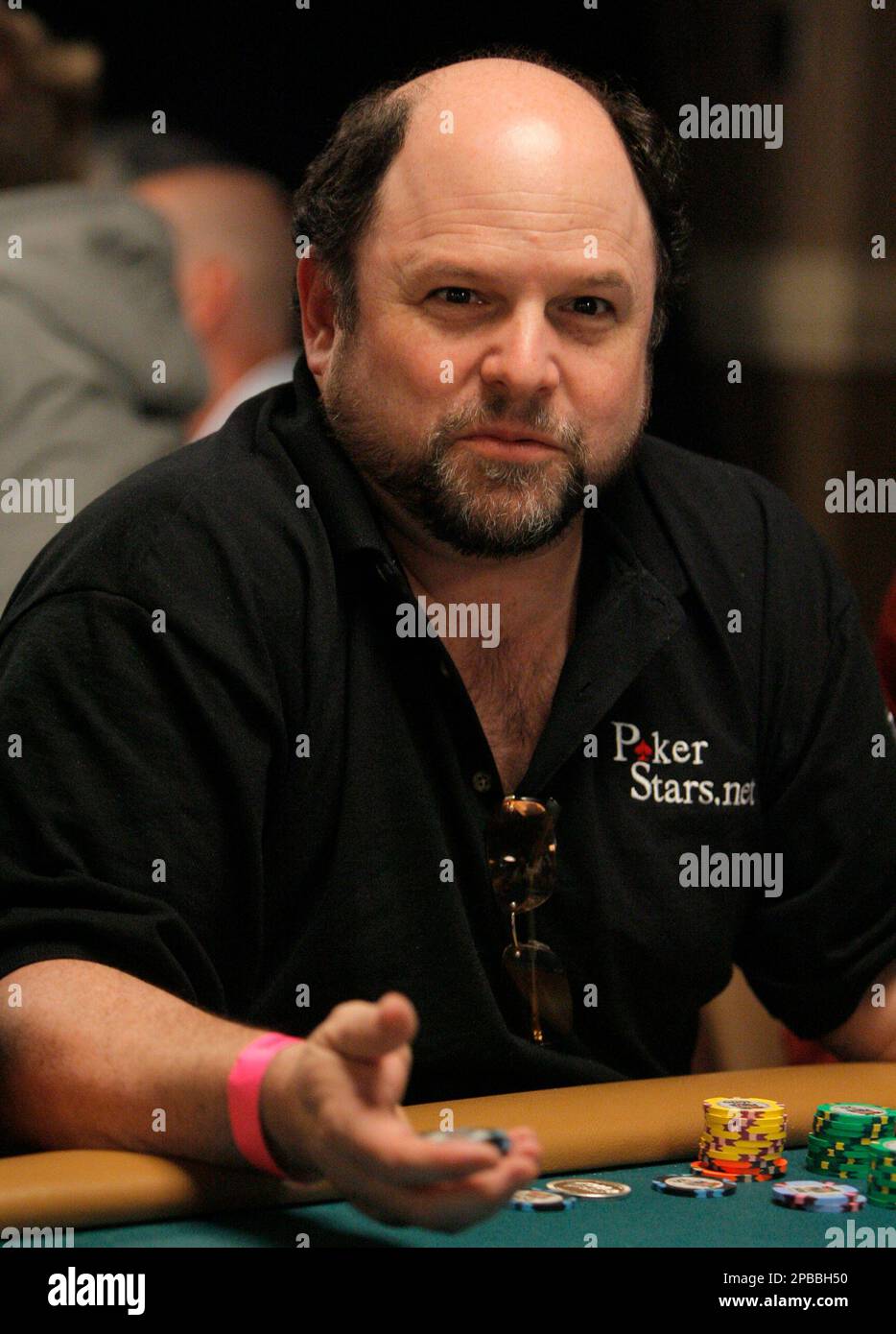 Actor Jason Alexander plays during the $10,000 buy-in main event of the ...