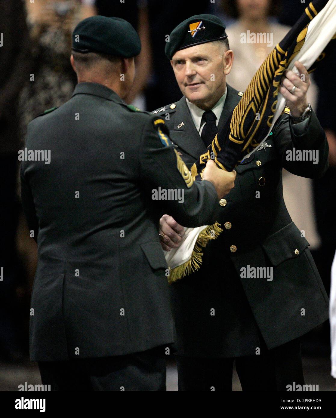 U.S. Army Gen. Doug Brown, right, receives the unit flag from Army ...
