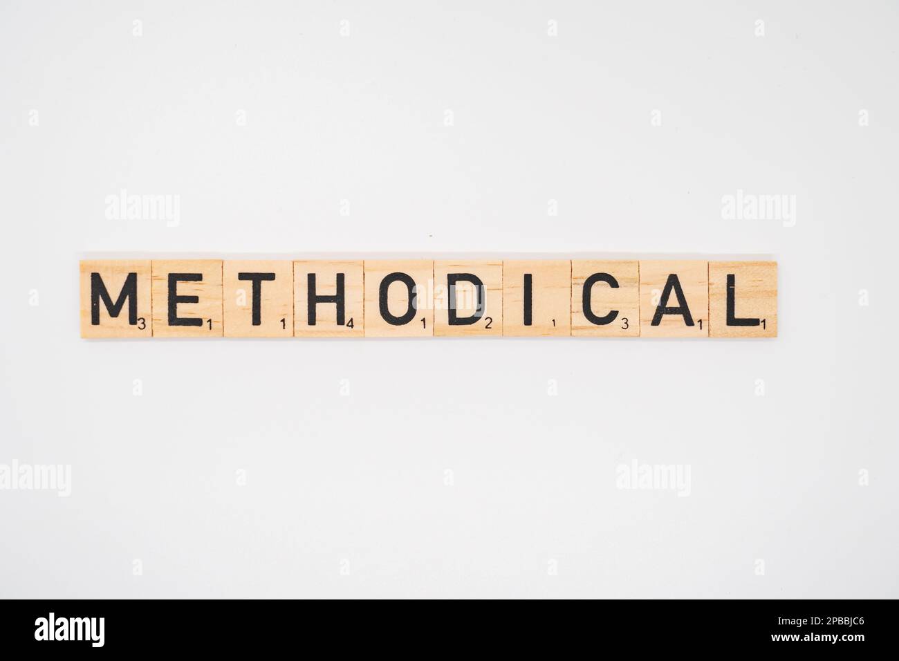 Wooden title spelling the word methodical isolated on a white ...
