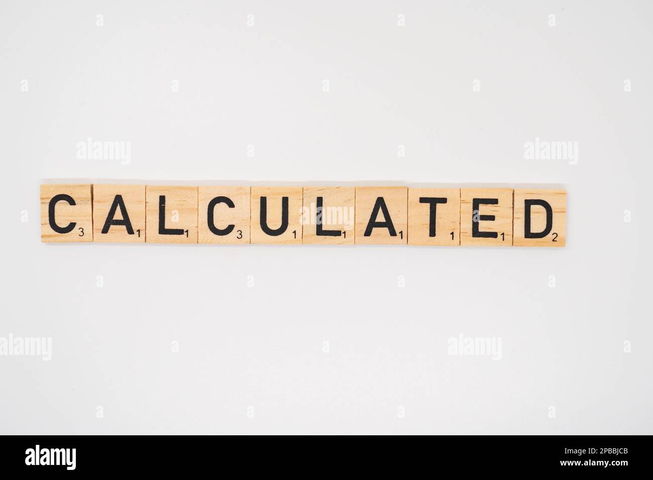 Wooden title spelling the word calculated isolated on a white ...