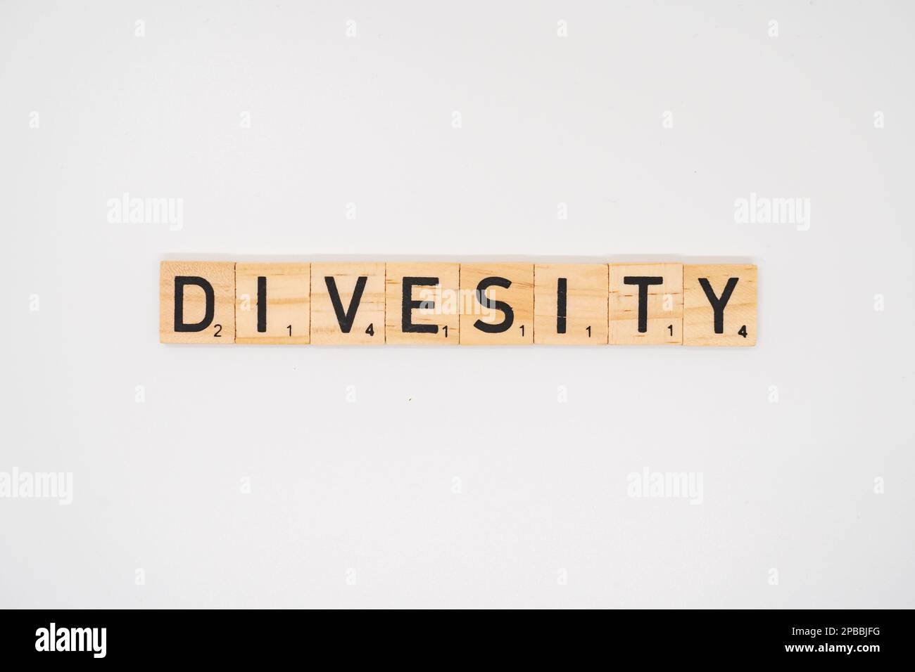 Wooden title spelling the word diversity isolated on a white background ...