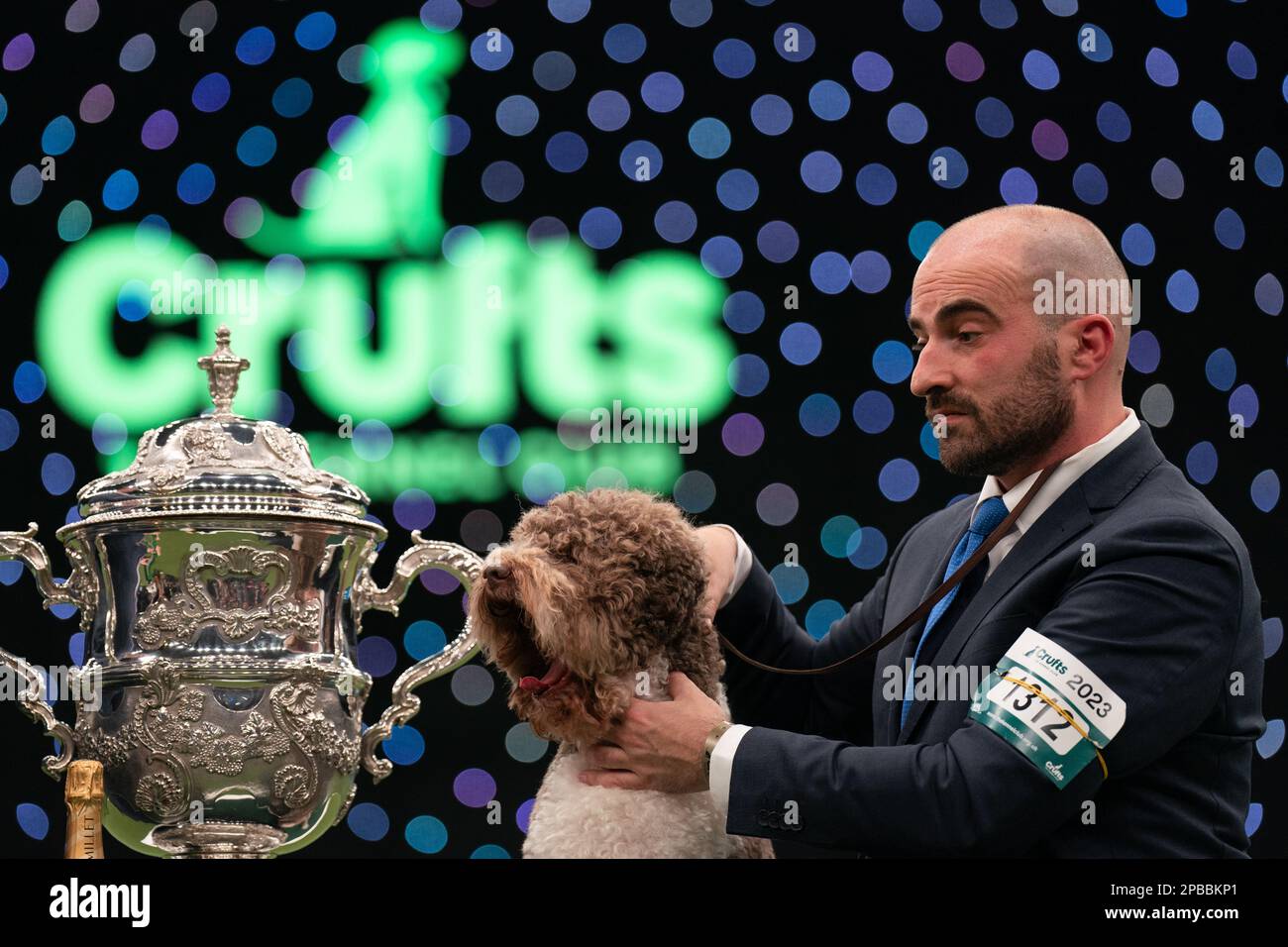 Orca the Lagotto Romagnolo with handler Javier Gonzalez Mendikote who ...