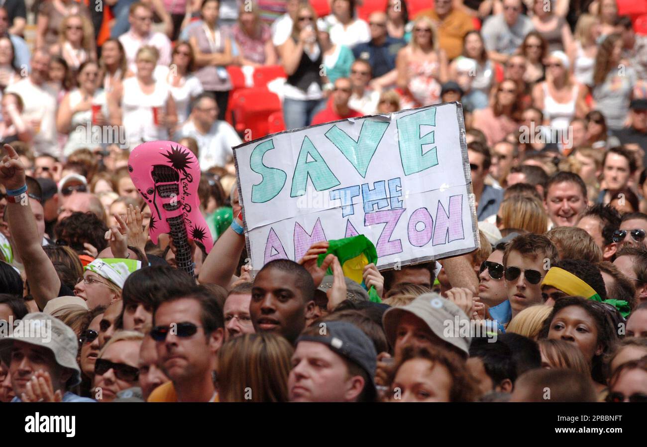The audience watch on during the British leg of the Live Earth concerts ...