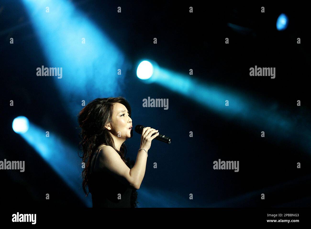 Taiwanese singer Winnie Shin performs during the Live Earth concert ...