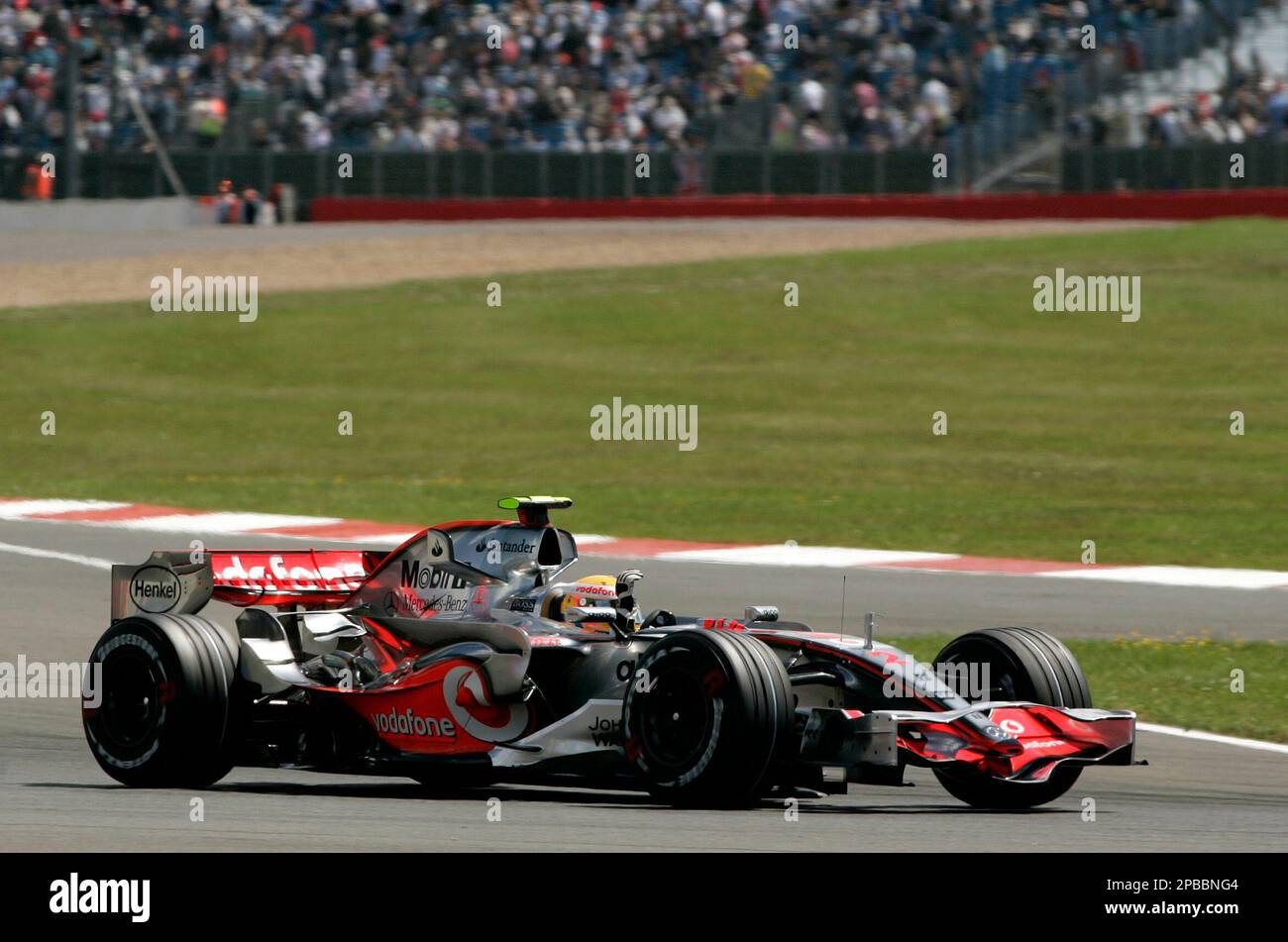 McLaren Mercedes Formula One driver Lewis Hamilton celebrates his pole ...
