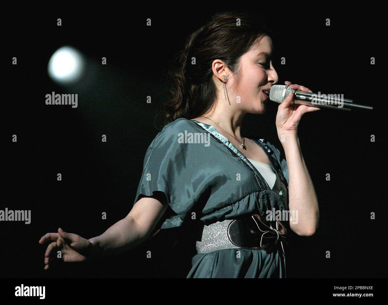 Taiwanese singer Evonne Hsu performes during the Live Earth concert ...