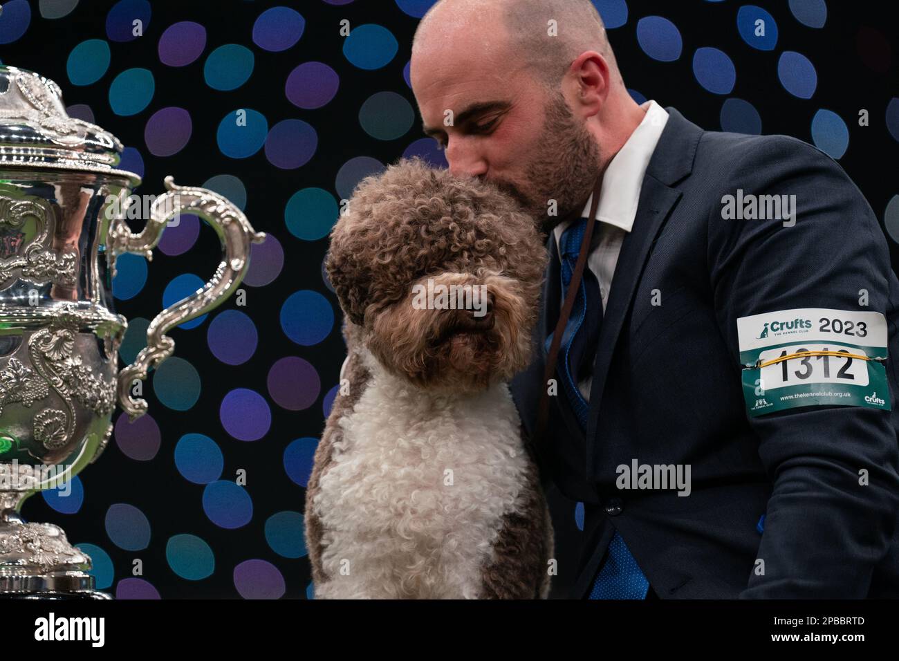 Orca the Lagotto Romagnolo with handler Javier Gonzalez Mendikote who ...