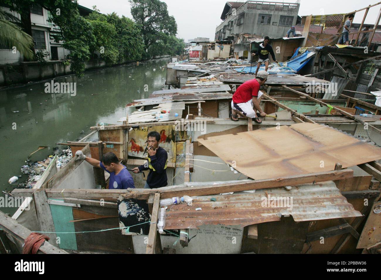 Manila City government demolition crew tear down the remaining shanties ...