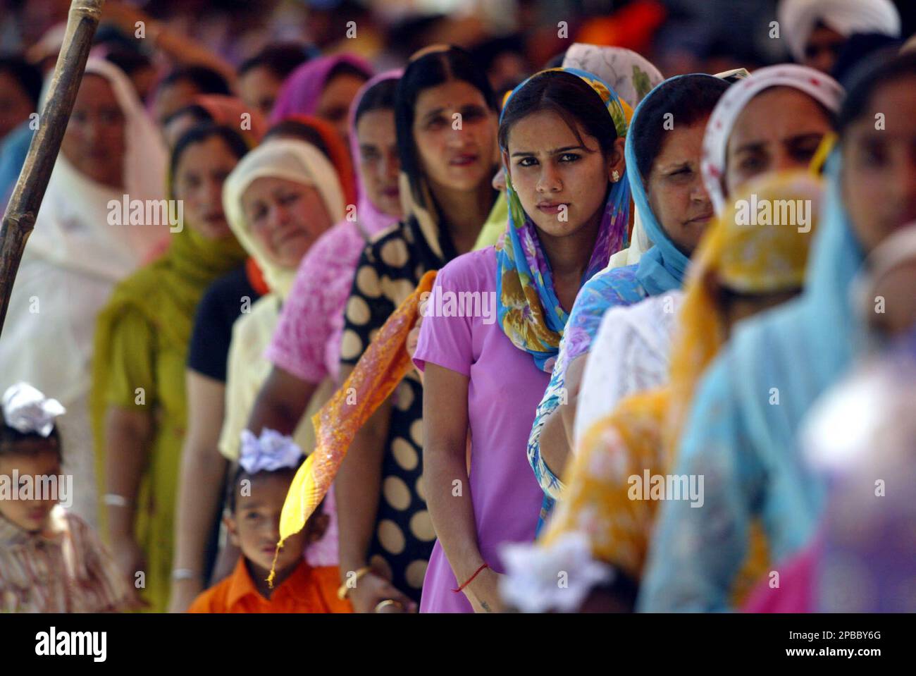 Devotees arrive for a prayer at a Sikh temple on the occasion of the ...