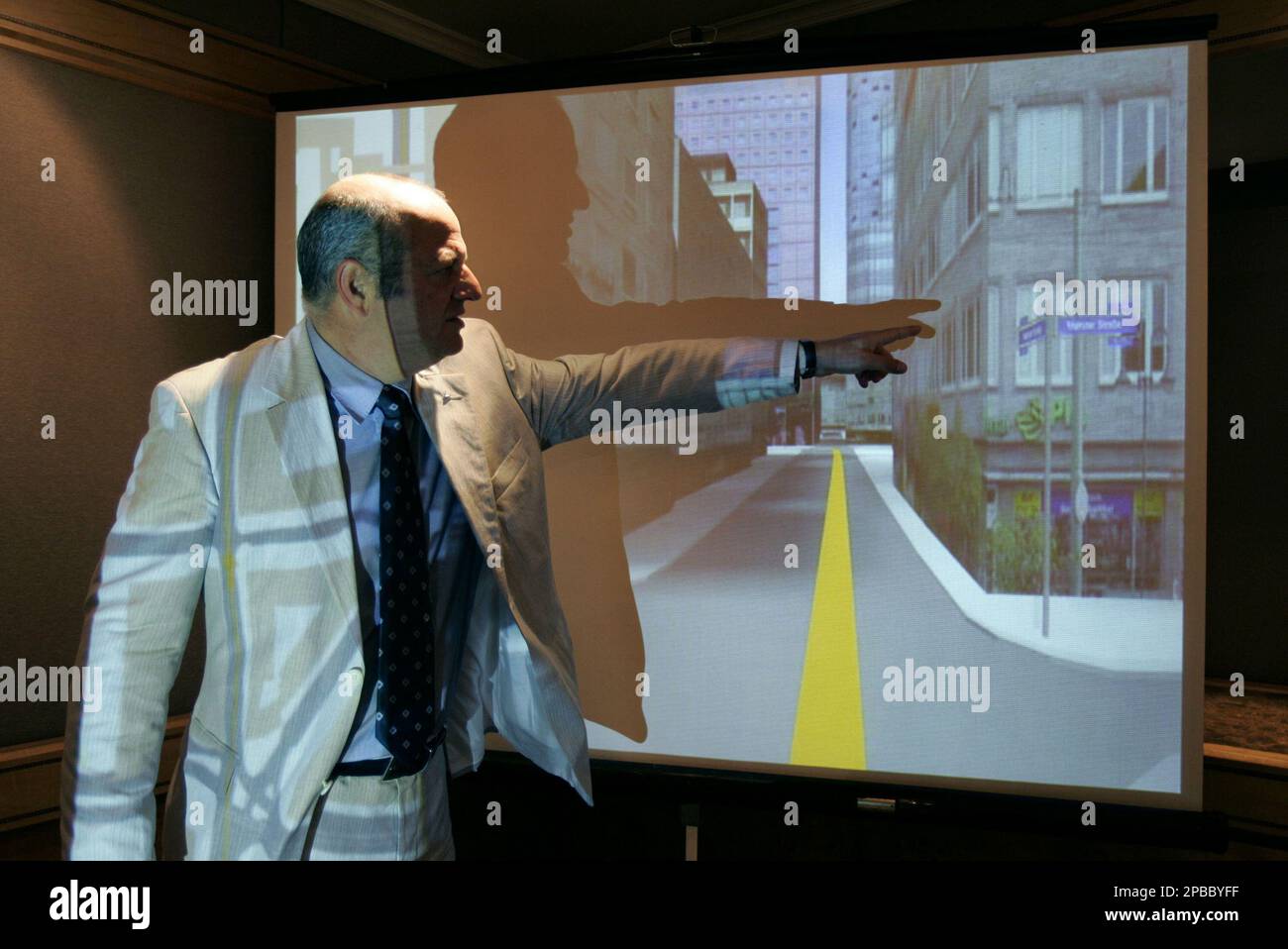 Tele Atlas CEO Alain de Taeye points to fine details of the company's ...