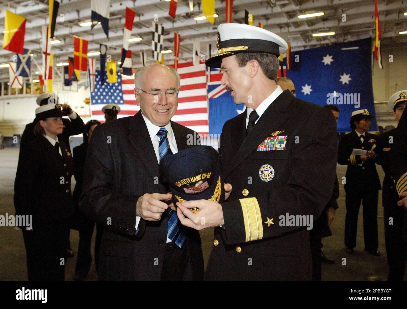 Rear Admiral Rick Wren, right, presents a cap to Australian Prime ...