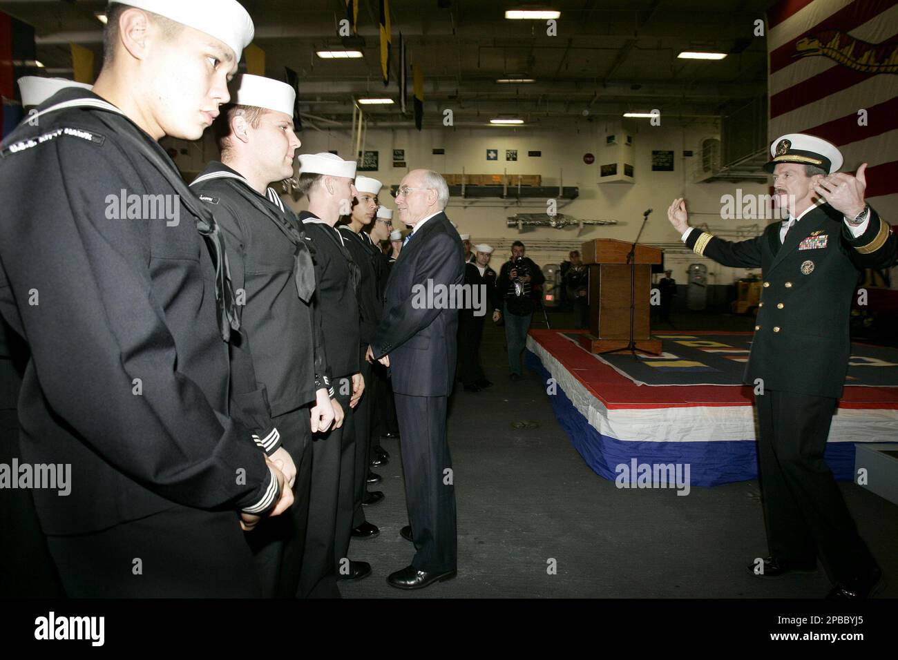 U.S. Navy Rear Adm. Rick Wren, right, encourages sailors to come ...