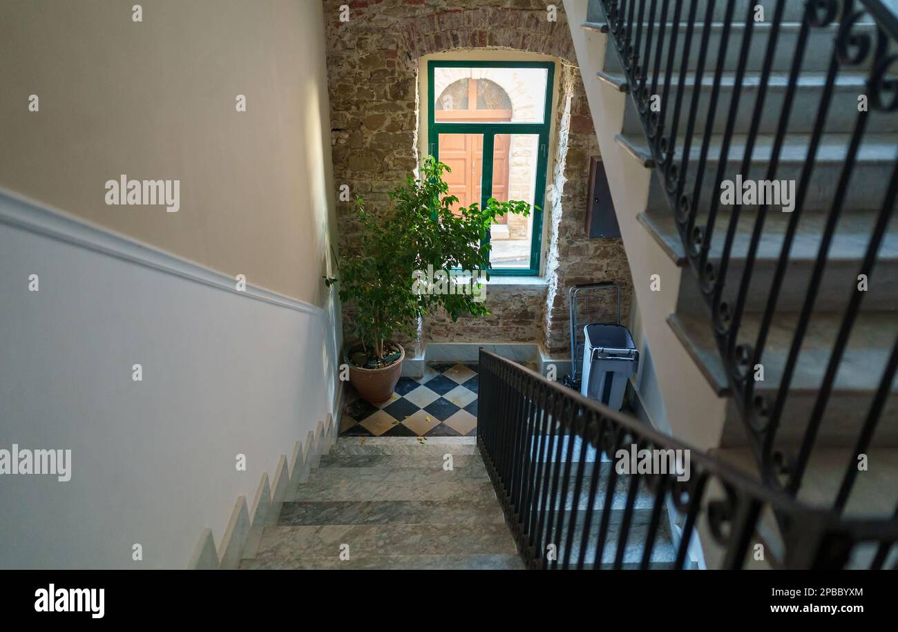 Staircase in the interior with marble floor. Porch inside the building ...