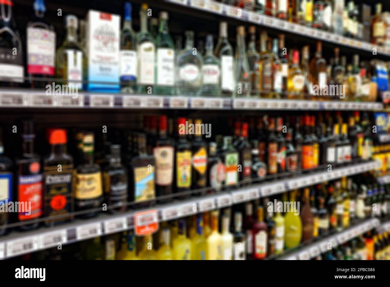 Blurred image of shelves with alcoholic drinks in supermarket Stock ...