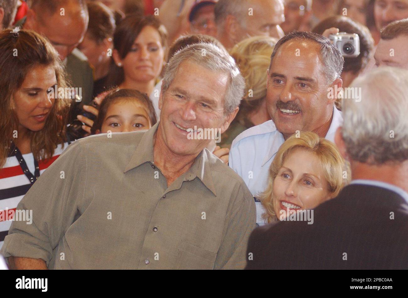 President Bush poses for a photo with Master Sgt. David Remsberg. and ...