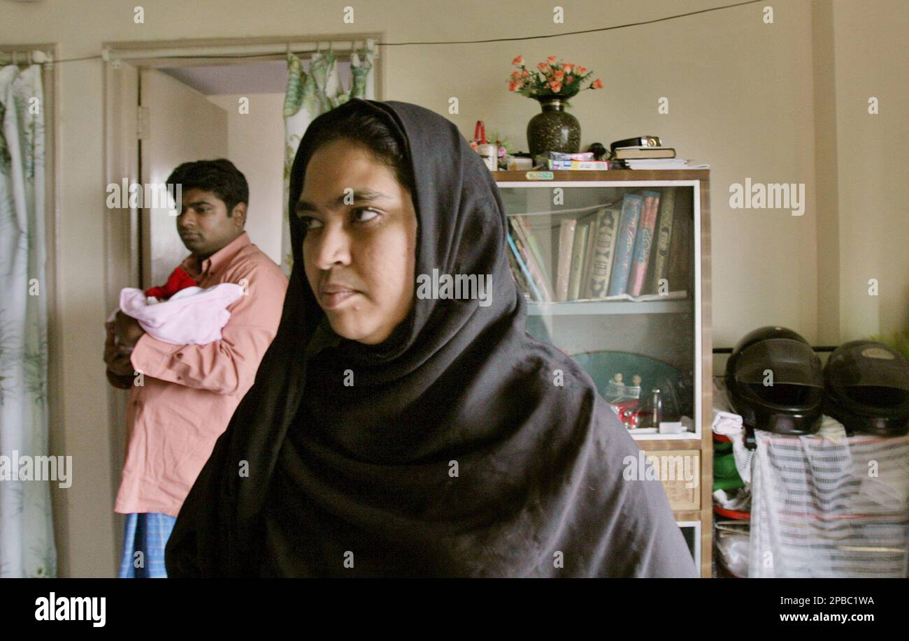 Nikhat Yasmeen, center, aunt of Muhammad Haneef, speaks to the media as ...