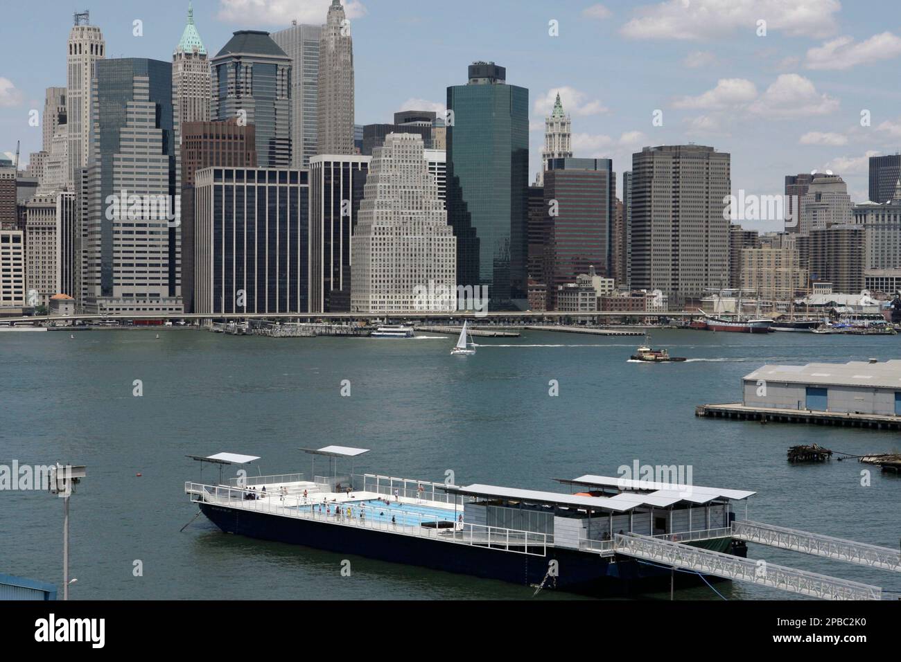 New York City's skyline is visible as a backdrop for the Floating Pool ...