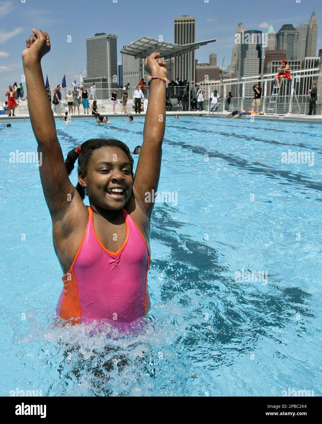 New York City's skyline is visible as Nayhira Baird, 9, celebrates the ...