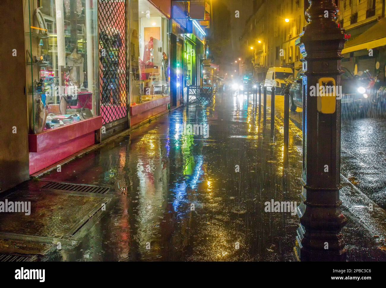 Amazing night view in autumn in rain in Paris in wet asphalt and street ...