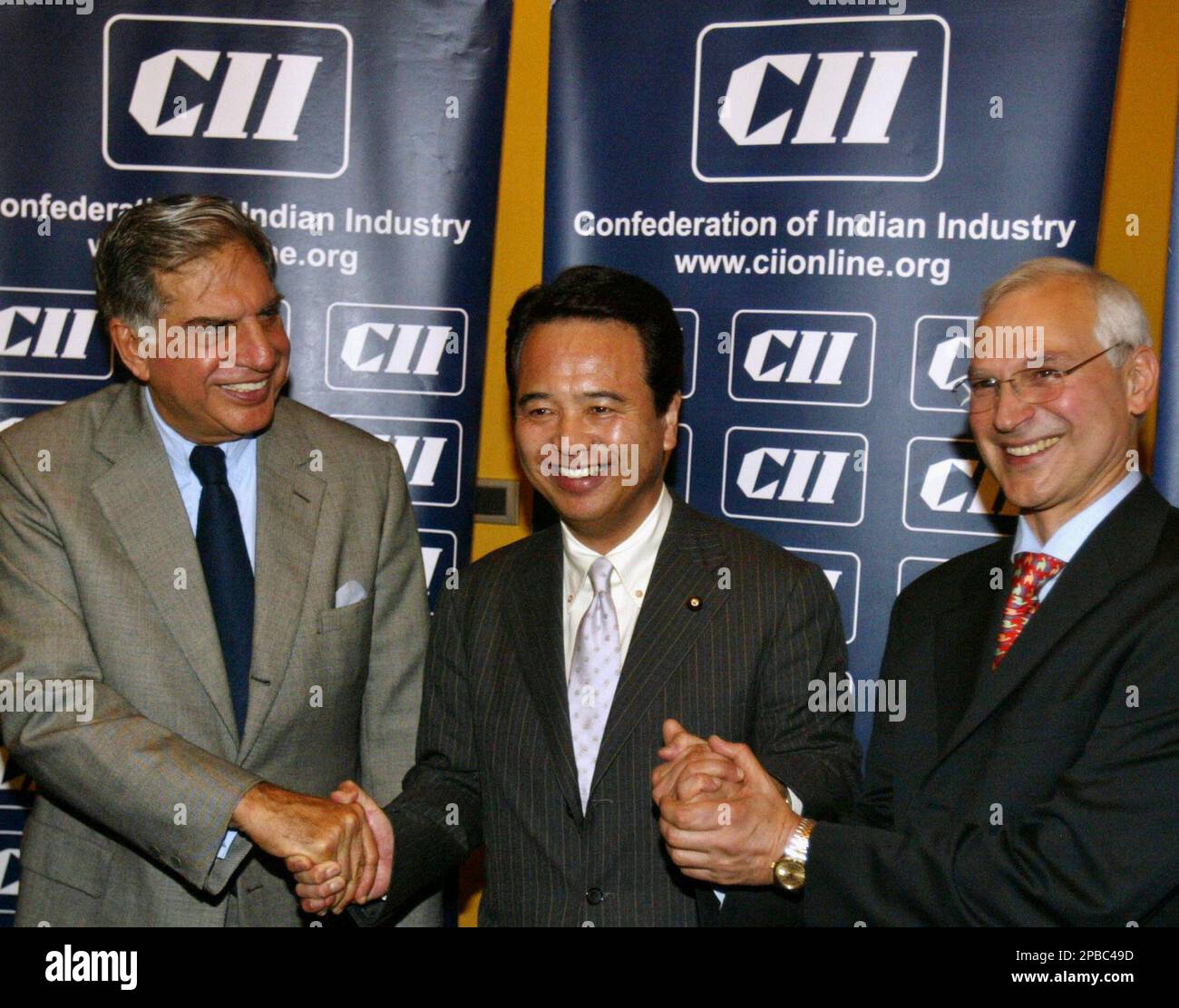 Japan's Minister of Economy, Trade and Industry Akira Amari, center ...