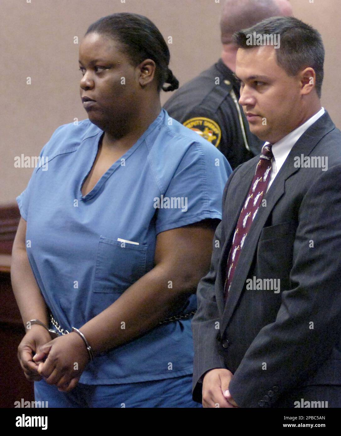 Myisha Ferrell, 29, left, stands with her attorney, John Alexander, Jr ...