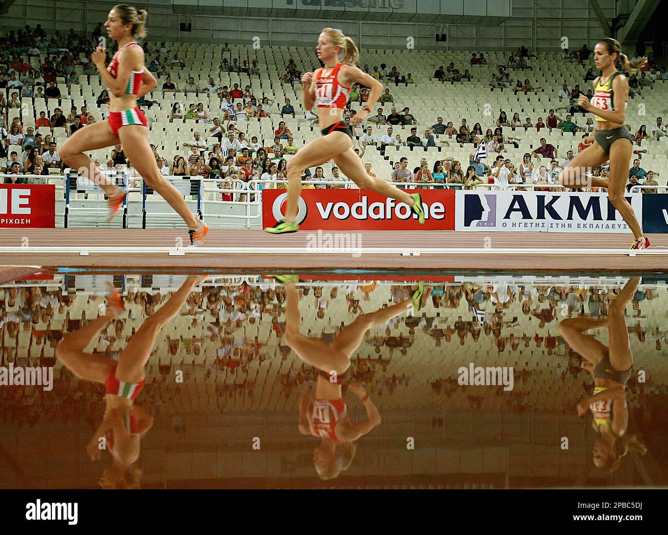 Russia's Samitova-Galkina, right, competes in the 3,000m steeple chase ...