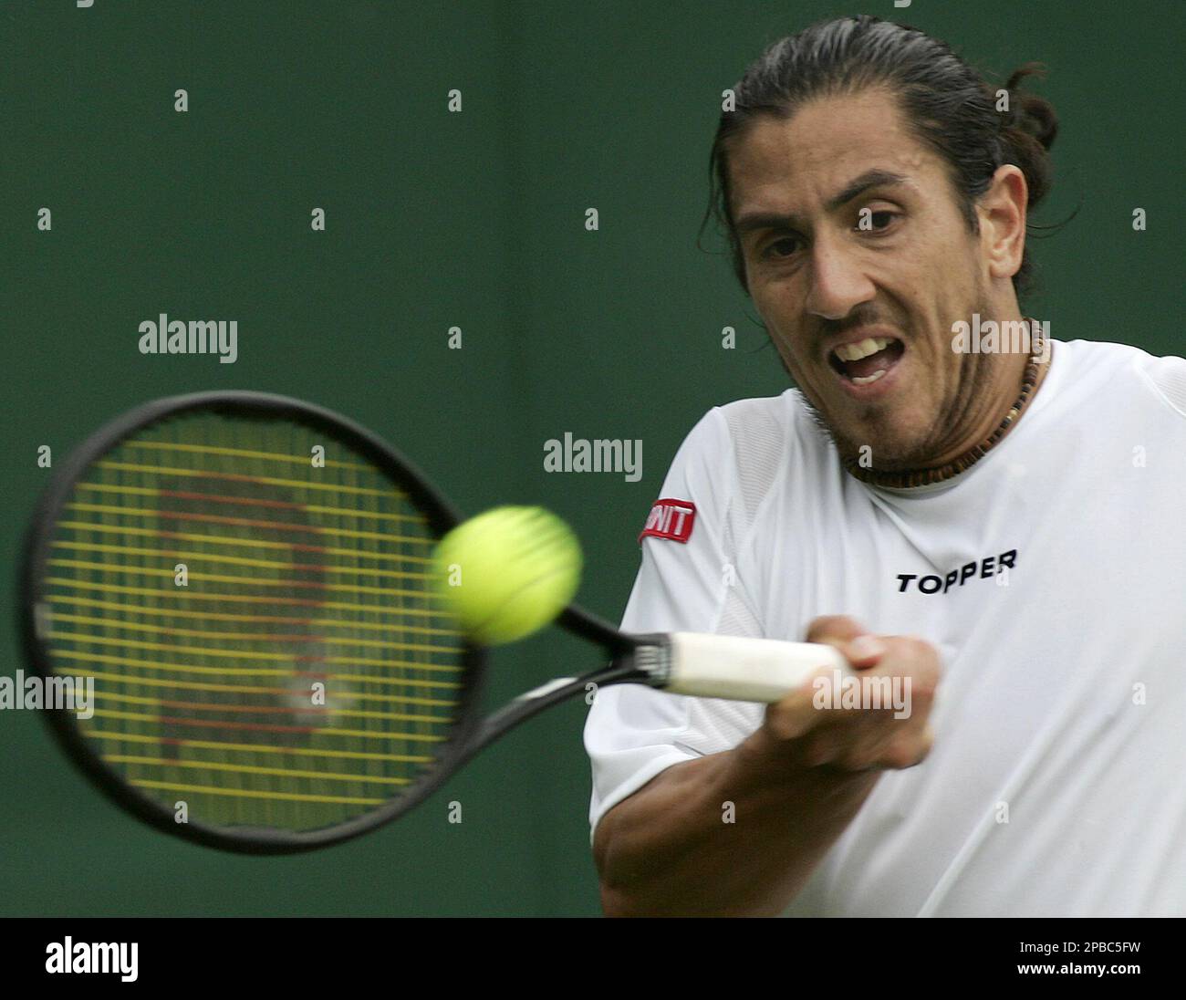 Argentina's Guillermo Canas returns to Australia's Lleyton Hewitt in a ...
