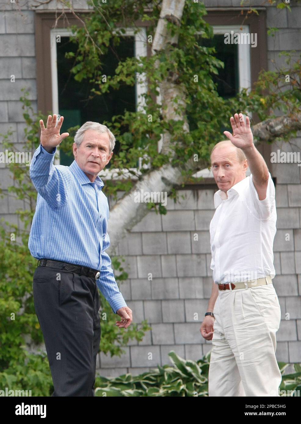 President Bush, left, and Russian President Vladimir Putin turn and ...