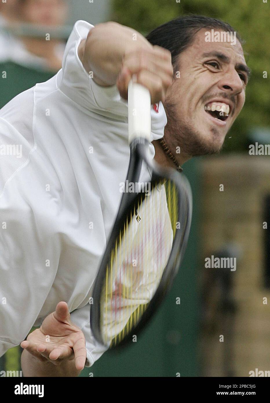 Argentina's Guillermo Canas serves to Australia's Lleyton Hewitt in a ...