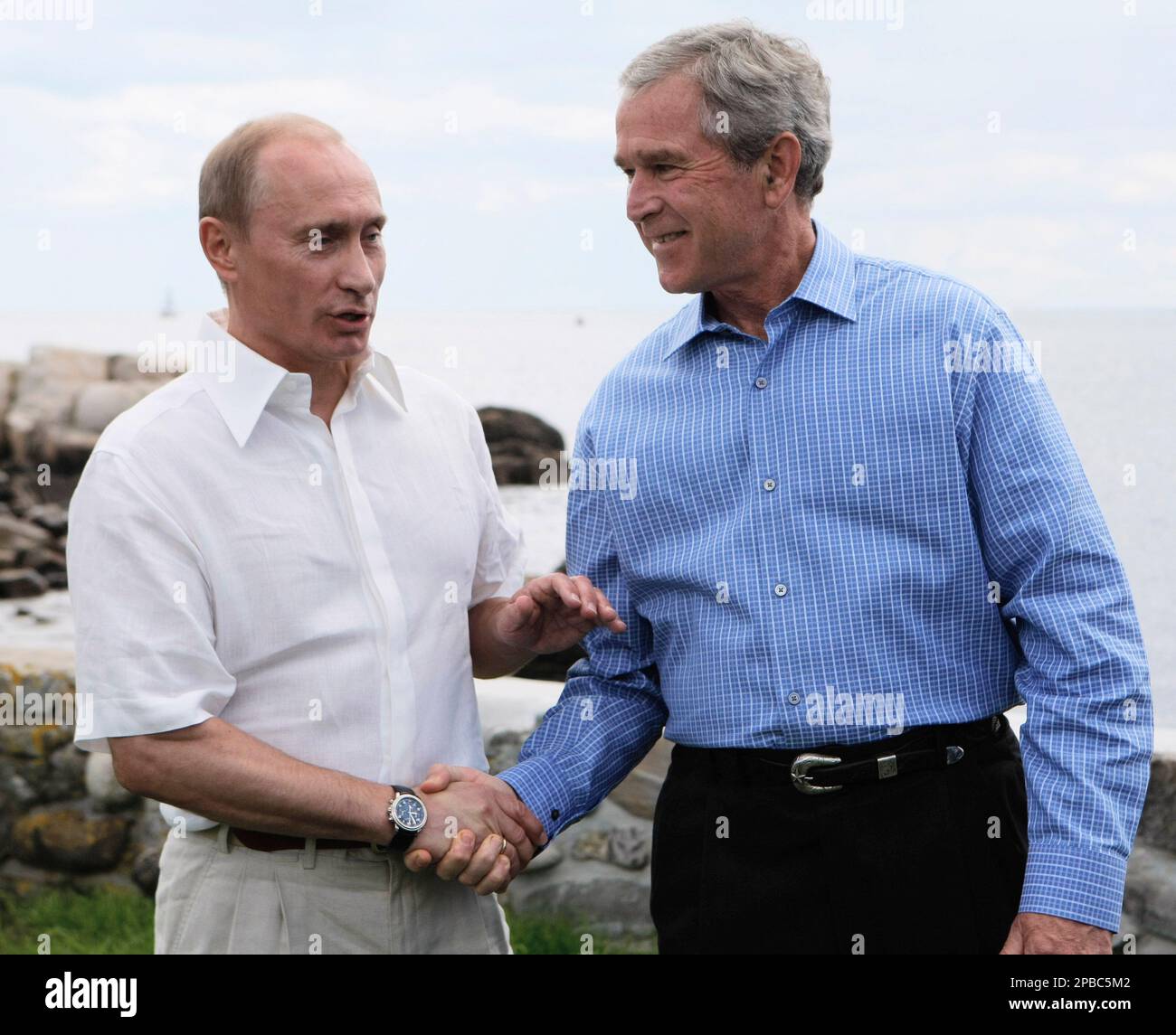 President Bush, right, shakes hands with Russian President Vladimir ...