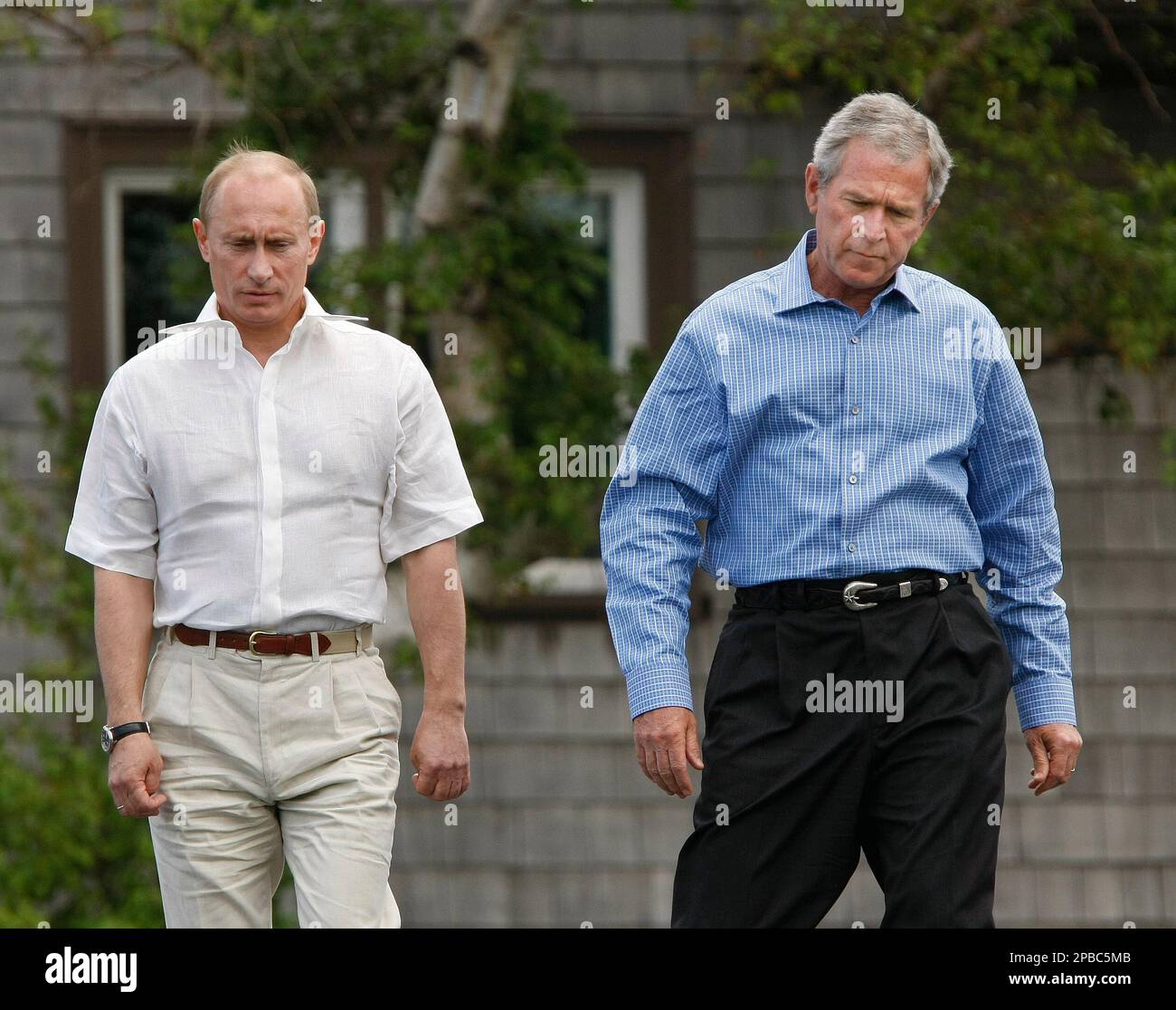 President Bush, right, and Russian President Vladimir Putin walk at the ...