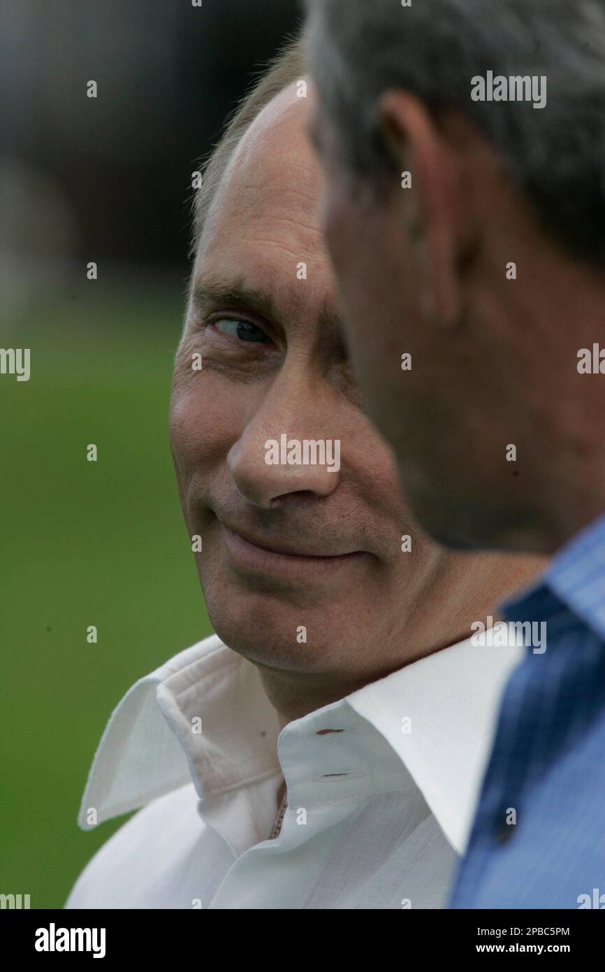 Russian President Vladimir Putin, left, looks toward President Bush ...