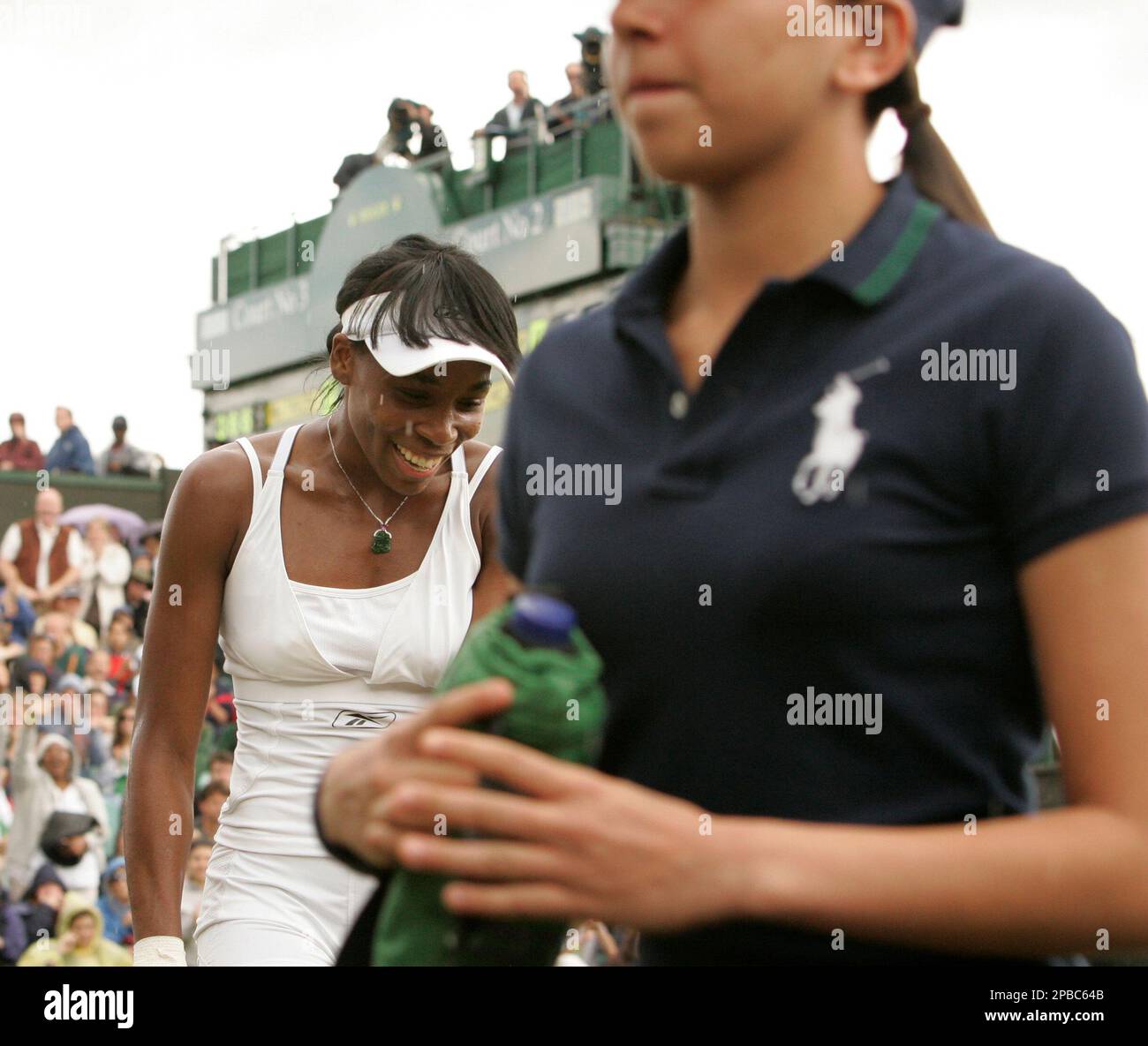 Venus Williams leaves the court in pouring rain, after defeating Japan ...
