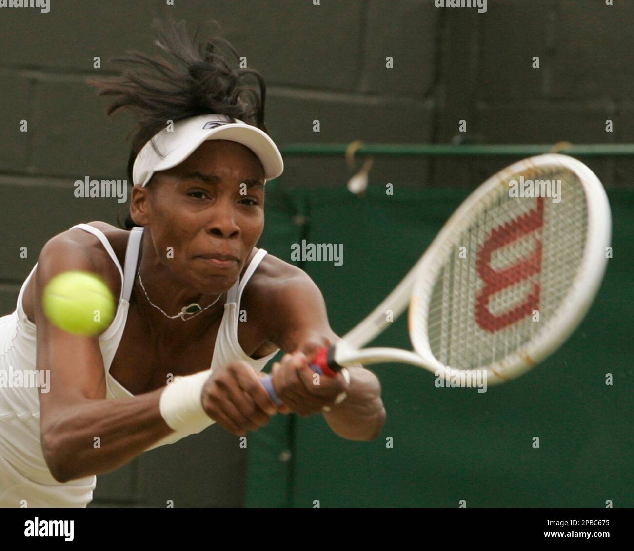 Venus Williams returns to Japan's Akiko Morigami, during their Women's ...