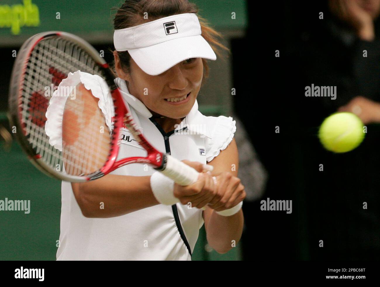 Japan's Akiko Morigami returns to Venus Williams of the US, during ...