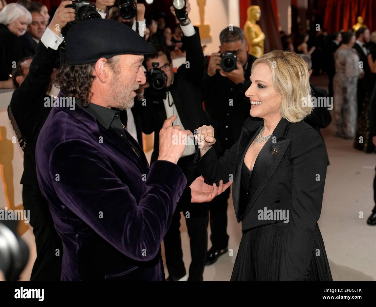 Troy Kotsur, left, and Marlee Matlin arrive at the Oscars on Sunday ...