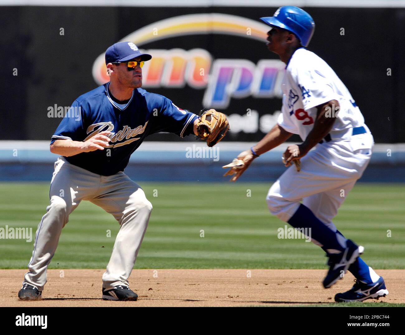 San Diego Padres second baseman Marcus Giles, left, tags out Los ...