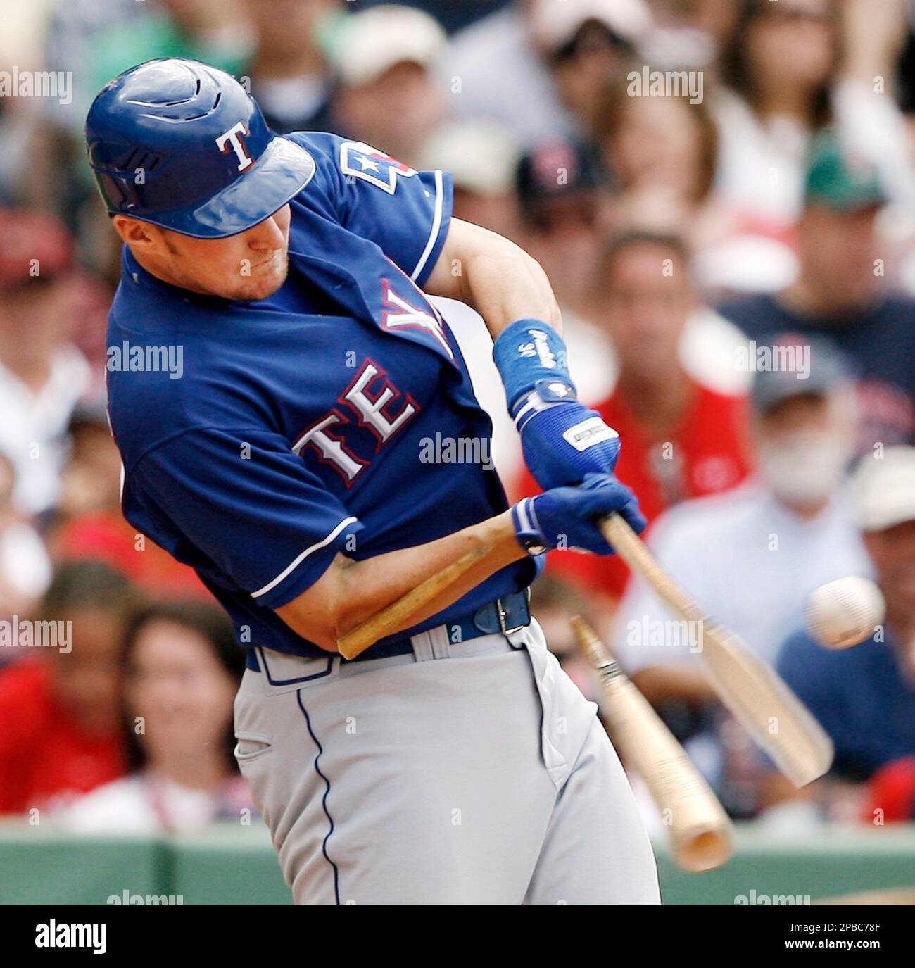 Texas Rangers' Travis Metcalf breaks his bat flying out to Boston Red ...