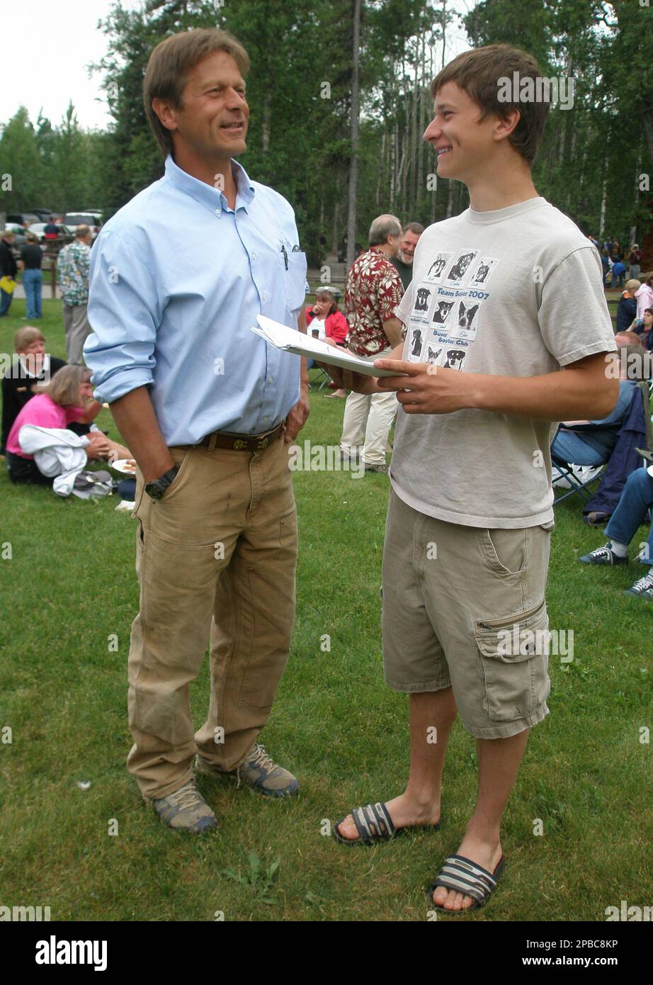 Four-time Iditarod champion Martin Buser, left, talks with his son ...