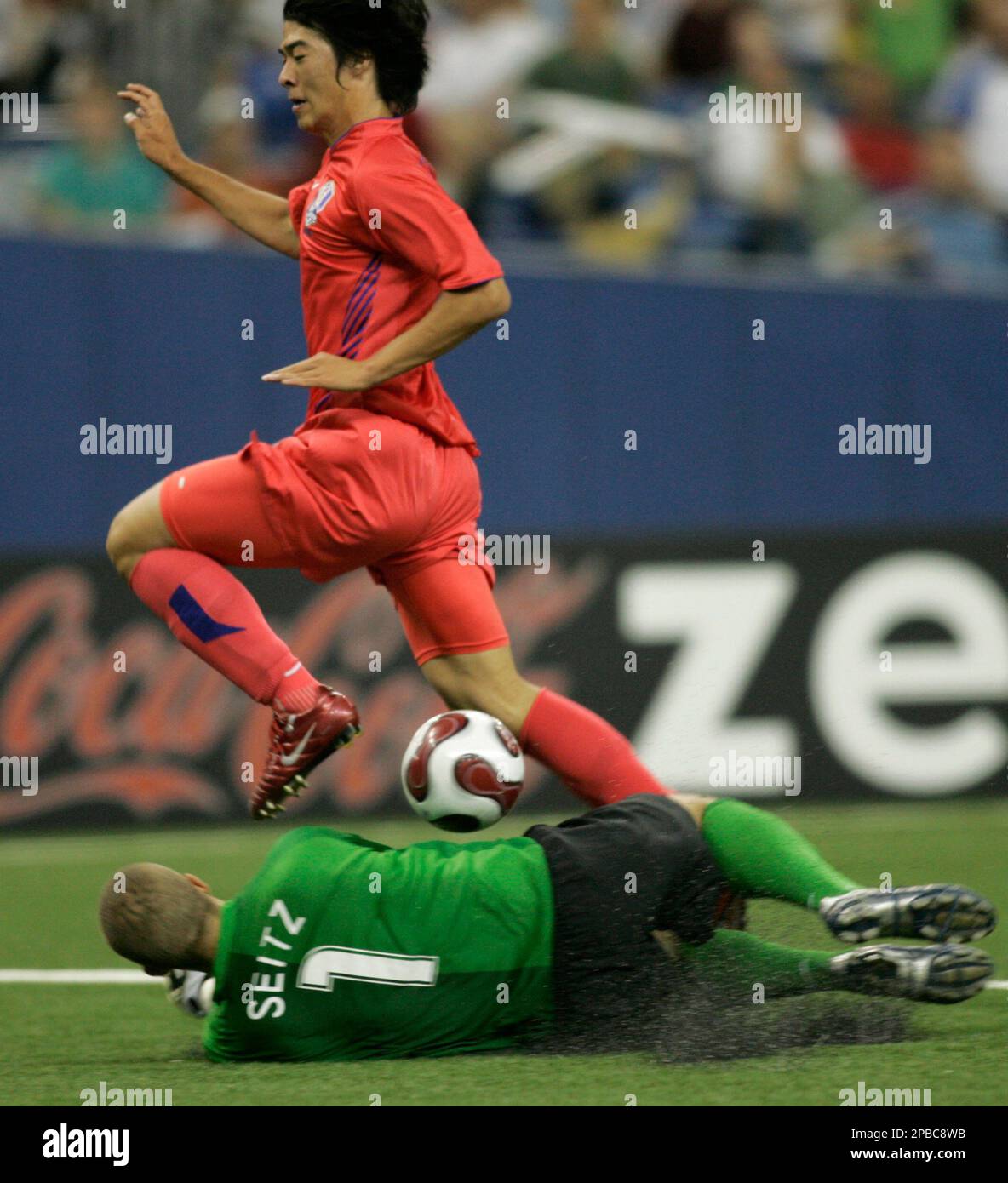 South Korea's Tae Goon Ha collides with USA goalie Chris Seitz on a ...