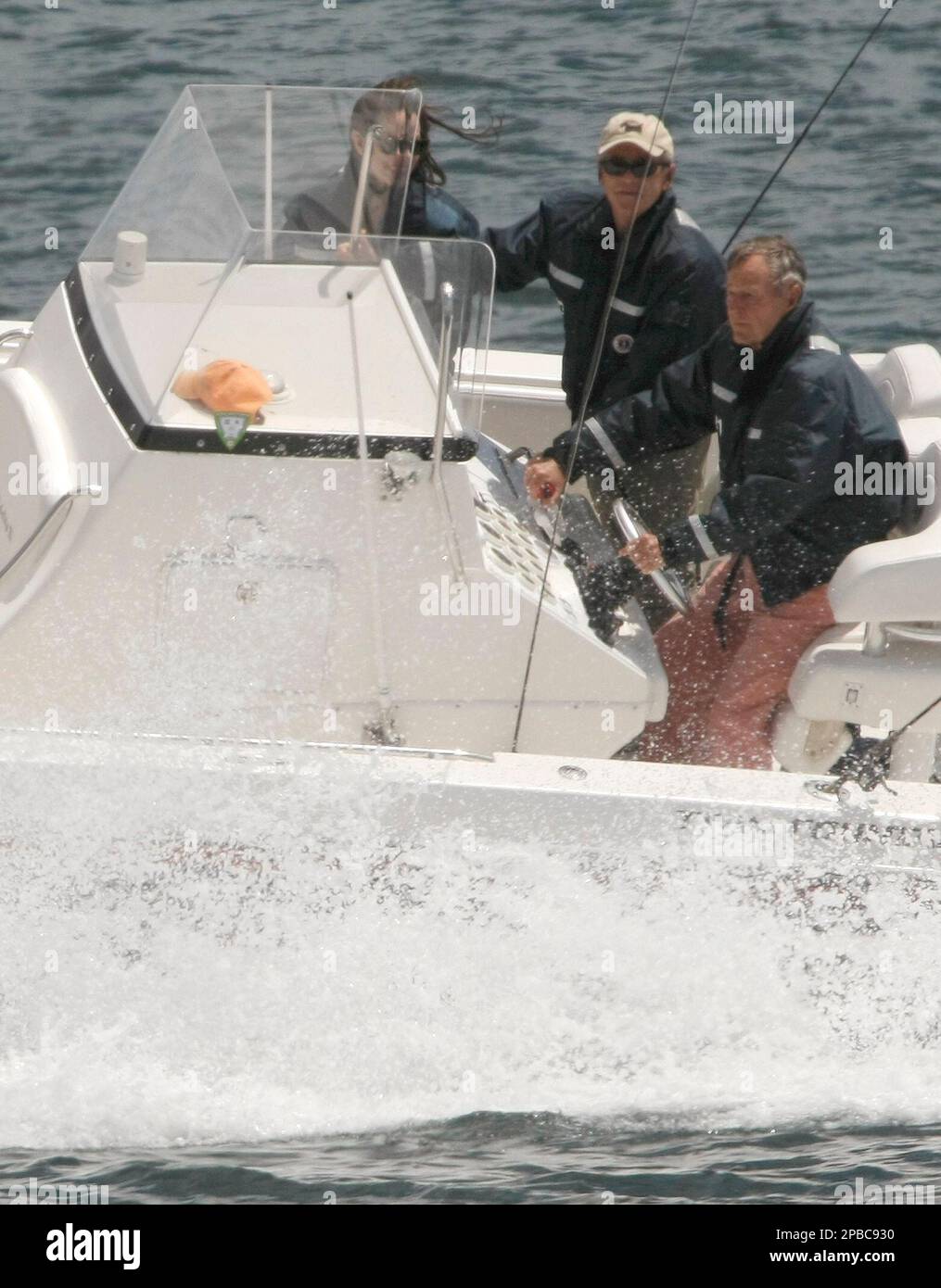 Former President George Bush, pilots his boat Fidelity III as President ...