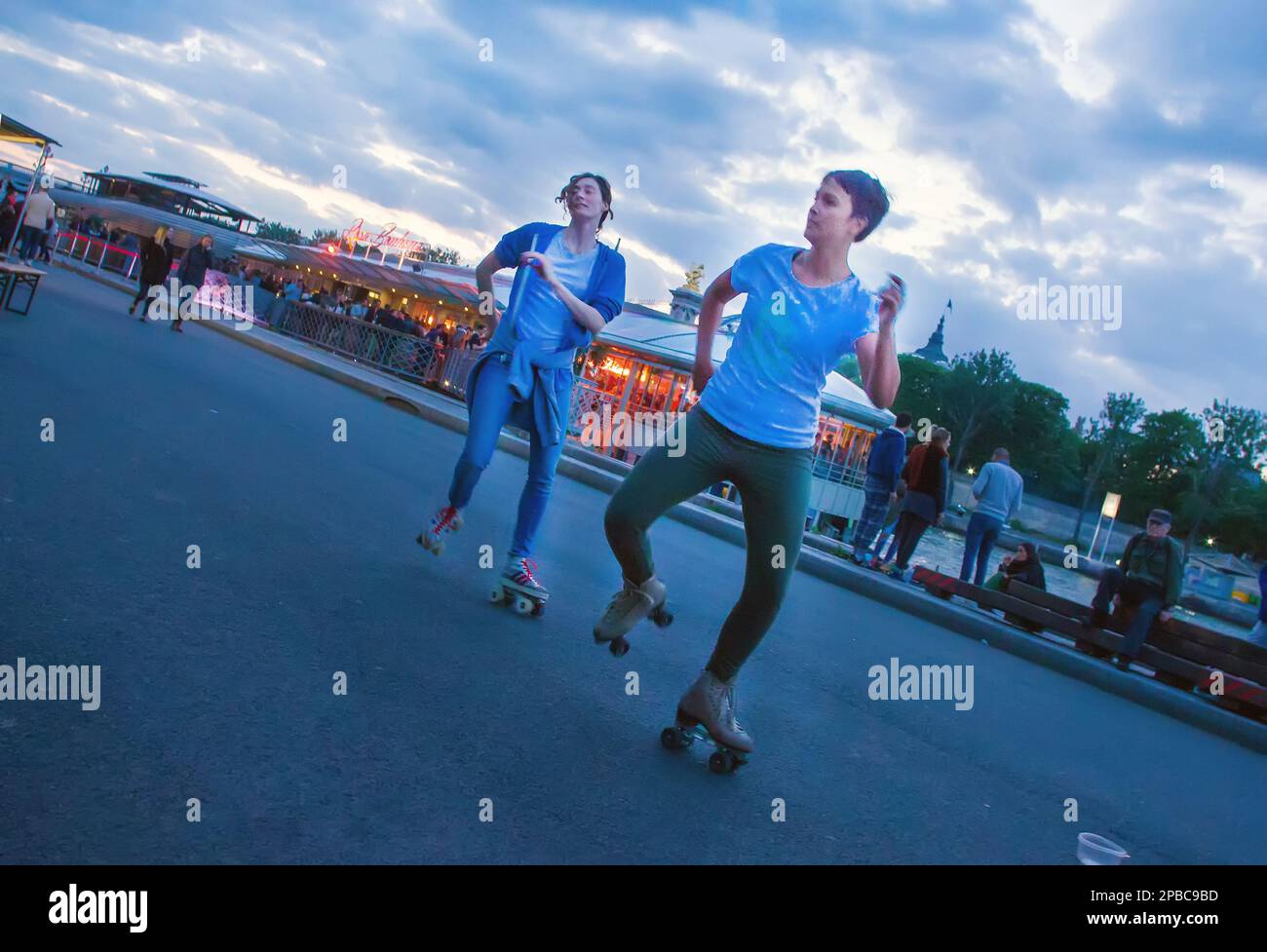 Young attractive american women People rollerblading on the Seine ...